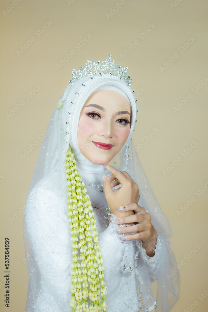 beautiful model, wearing hijab, Javanese Indonesian wedding dress in an ...