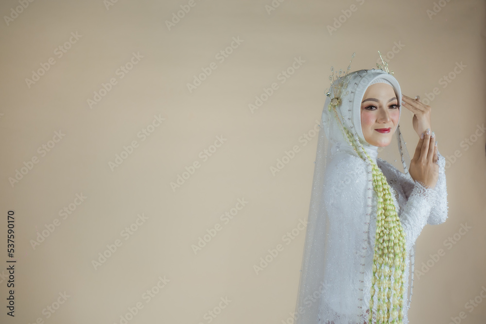 beautiful model, wearing hijab, Javanese Indonesian wedding dress in an ...