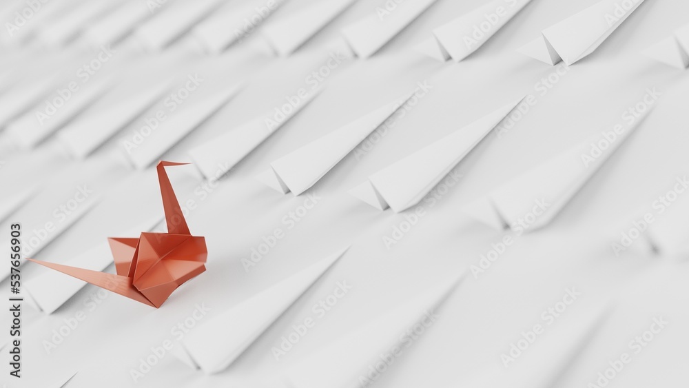 Origami of orange crane and many airplanes on white board under white ...