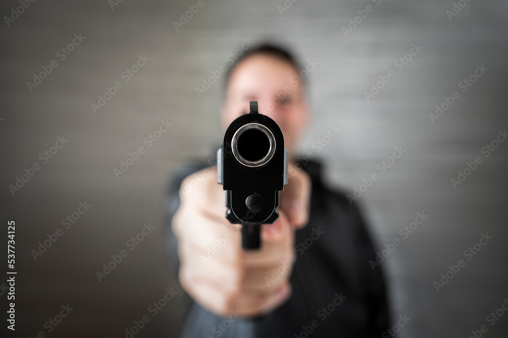 Brutal angry gang man lifestyle. Gangster action, killer aiming pistol ...