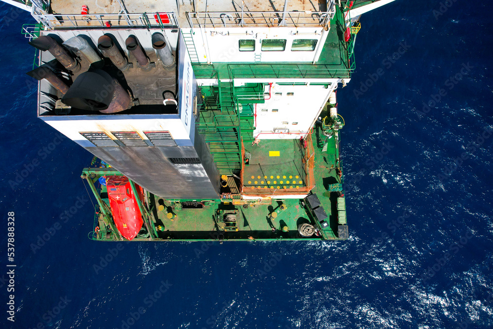 Aft construction part of container cargo vessel with funnel tubes, free ...