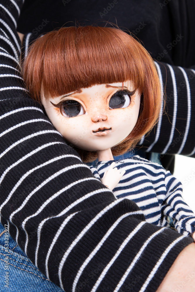 Doll red hairs in child girl hand toy fashion realistic scary plastic ...