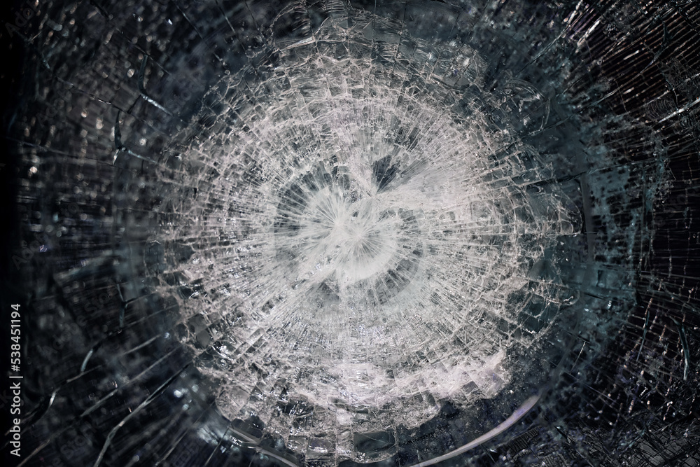 Bulletproof glass after test. bulletproof glass with cracks and a ...