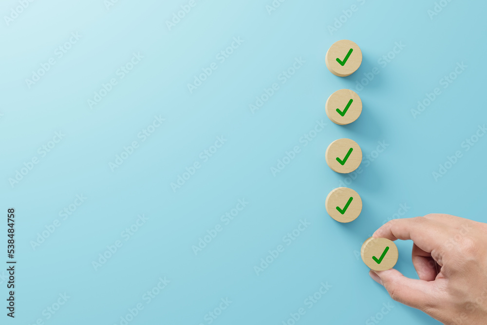 Checklist and check mark concept. Check mark on wooden blocks on light ...