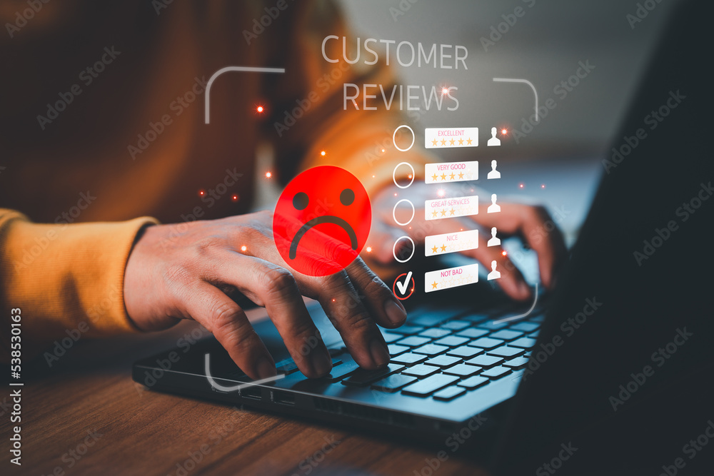 Unhappy man customer with sad emotion face on laptop. Bad review and ...