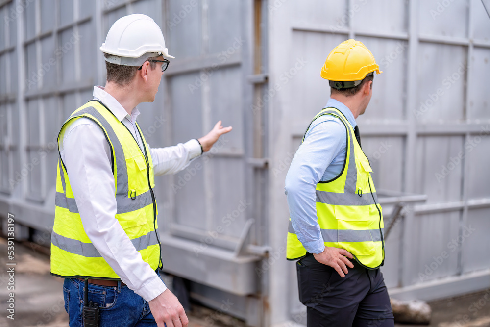 Engineer working at power station plant welcome site visit from senior ...