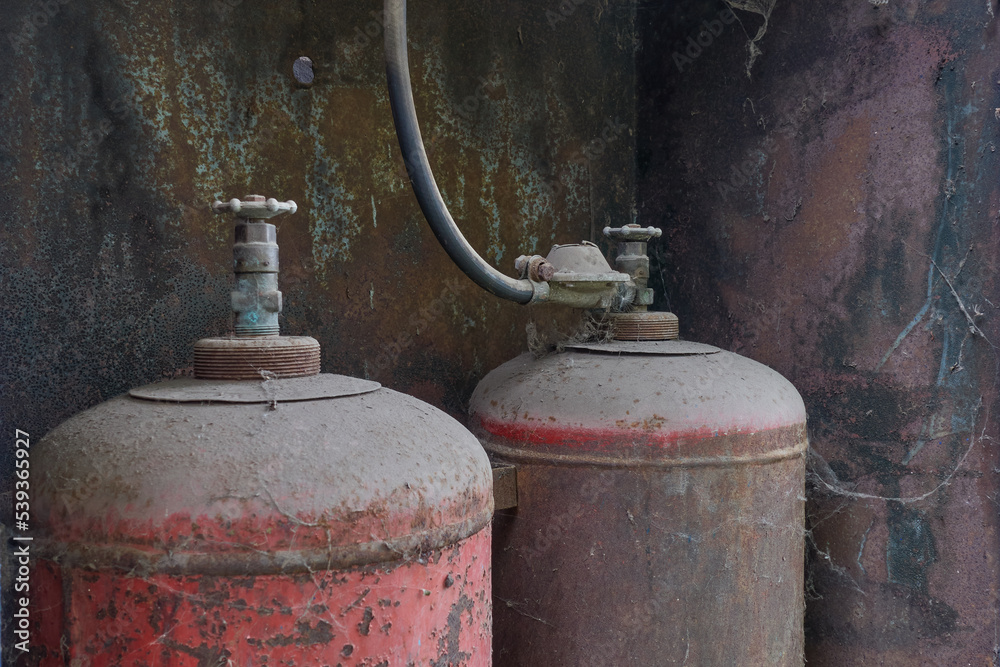 Old reducer on a gas cylinder. Rusty and dusty LPG storage tanks for ...