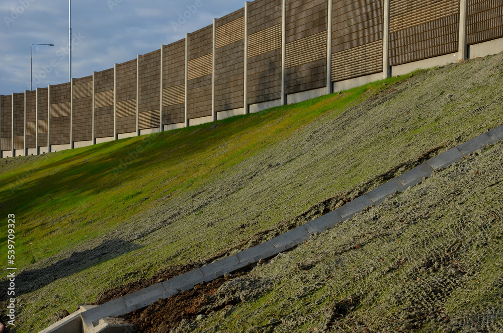 Foto de Stock stabilization of slopes by hydro sowing. mixture of wood ...