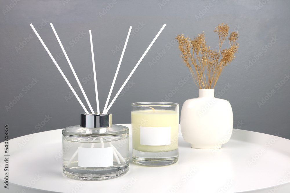 luxury aroma scent reed diffuser glass bottle is on white table with ...
