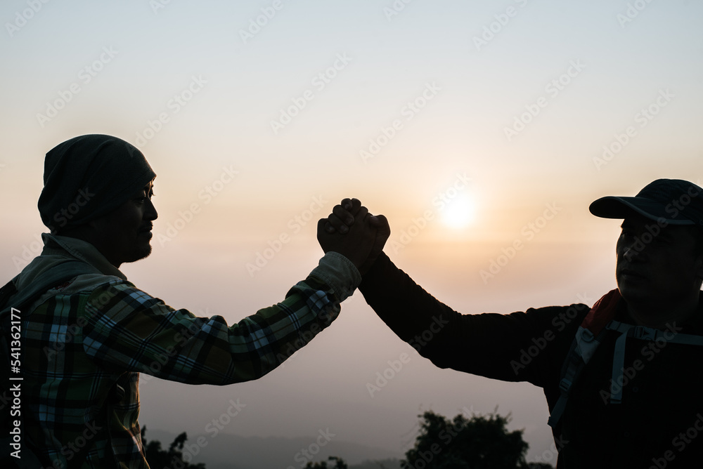 Silhouette of Teamwork helping hand trust help Stock Photo | Adobe Stock