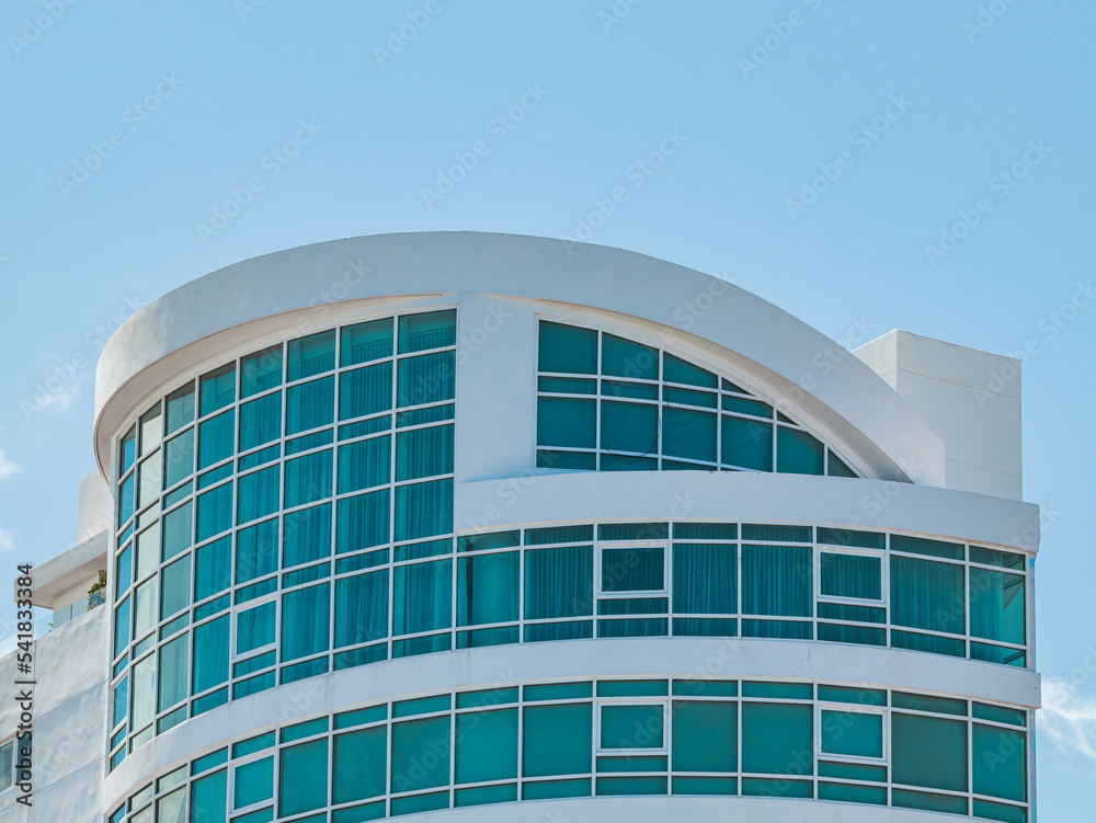 Arquitecture modern white arc shape building design with blue windows ...