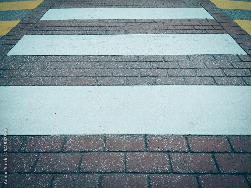 Red and yellow zebra crossings on a simple city street Stock Photo ...