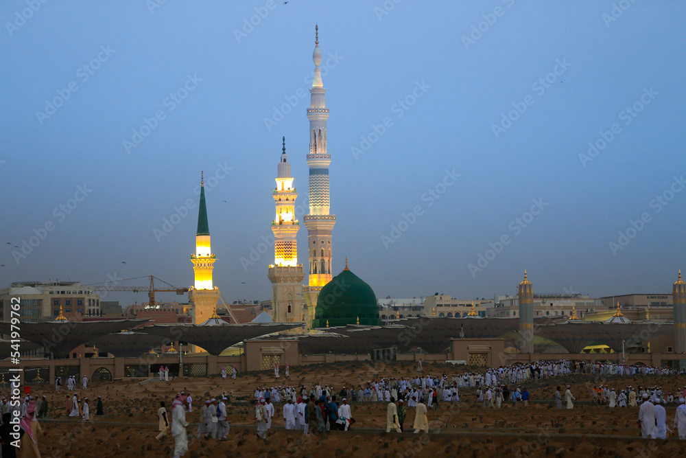 Muslim pilgrims visiting the beautiful Nabawi Mosque, and green dome of ...
