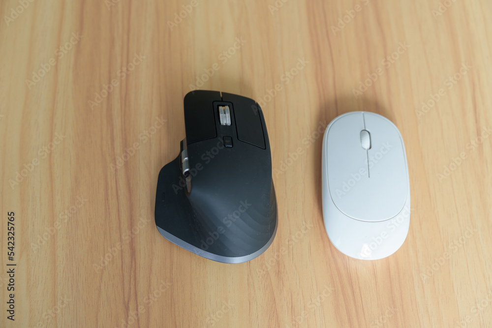 Comparison of Ergonomic vertical mouse and general mouse on desk at ...