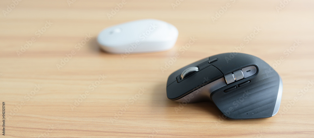 Comparison of Ergonomic vertical mouse and general mouse on desk at ...