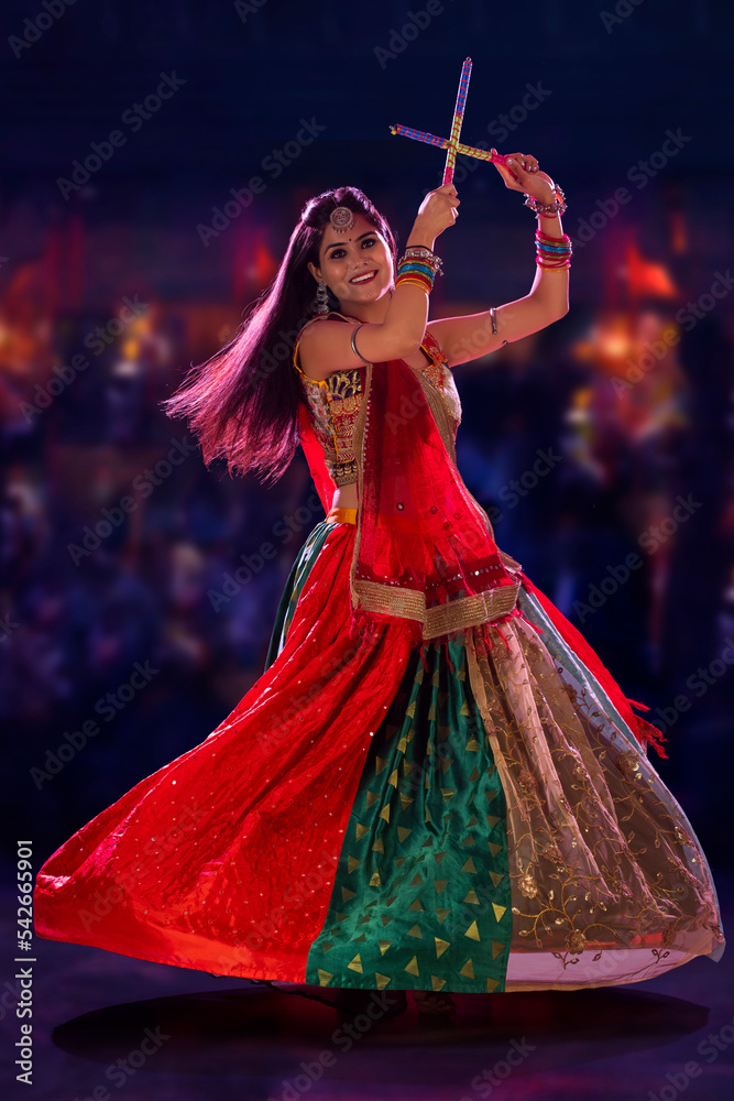 Gujrati woman performing Garba on stage Stock Photo | Adobe Stock