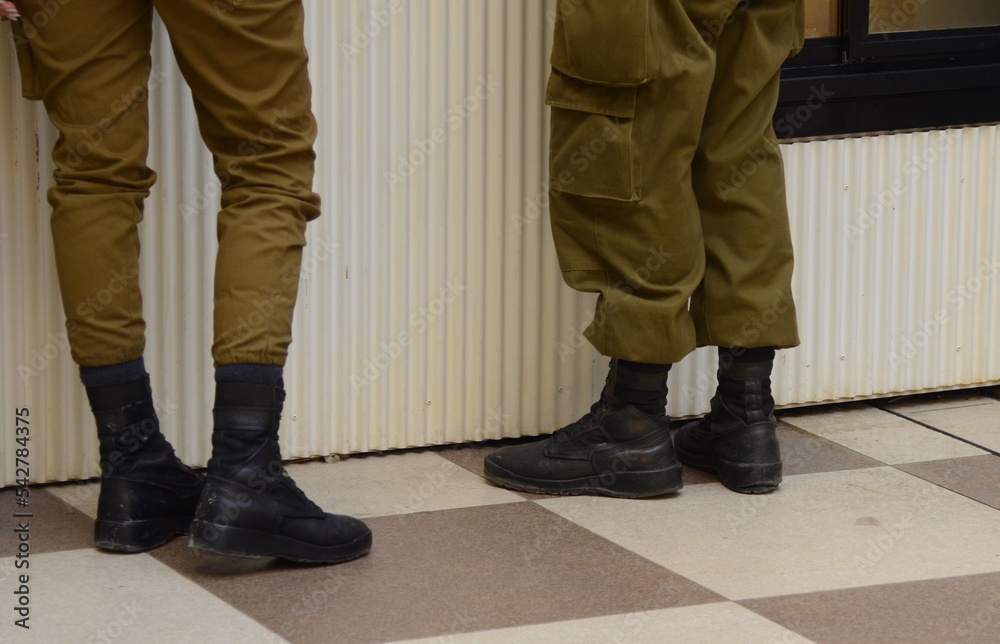 Soldier's boots on the feet of an Israeli soldier. Concept: Soldiers ...