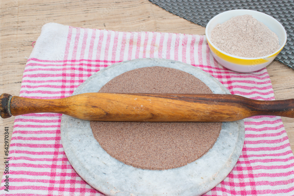 making round roti with the Dough of Ragi Nachni or finger millet flour ...