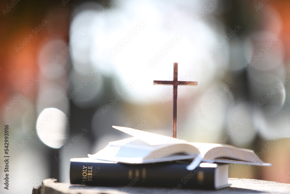 Church bright light background with holy bible and the cross of ...