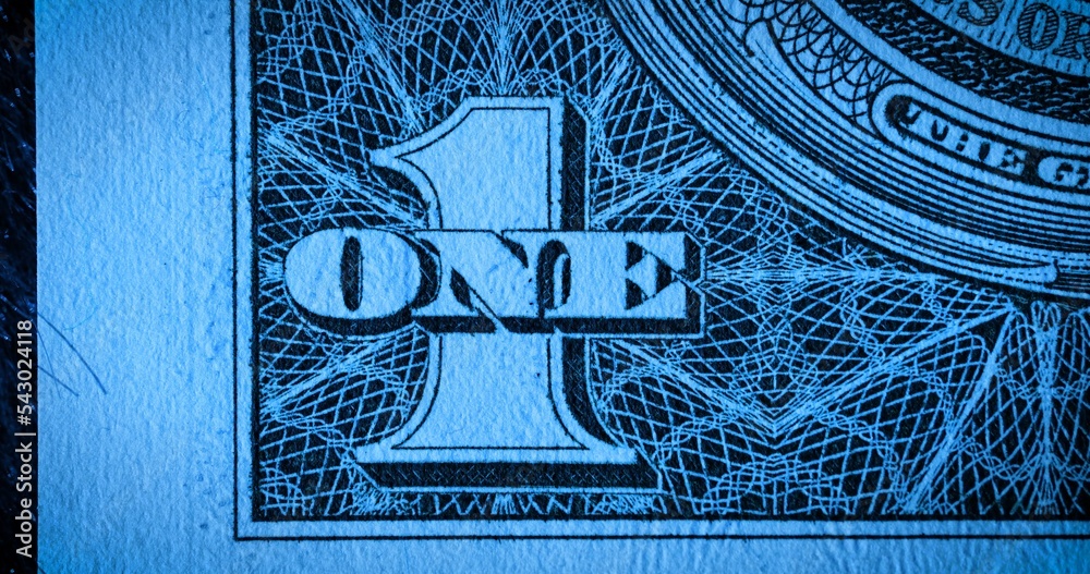 One dollar paper banknote in blue soft light. Macro shot of part of 1 ...