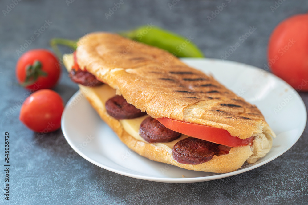 Turkish traditional toast sandwich, cheddar cheese, tomato, sausage ...