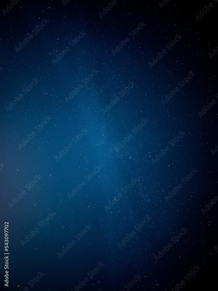 Vertical galaxy background with blue starry sky Stock Photo | Adobe Stock