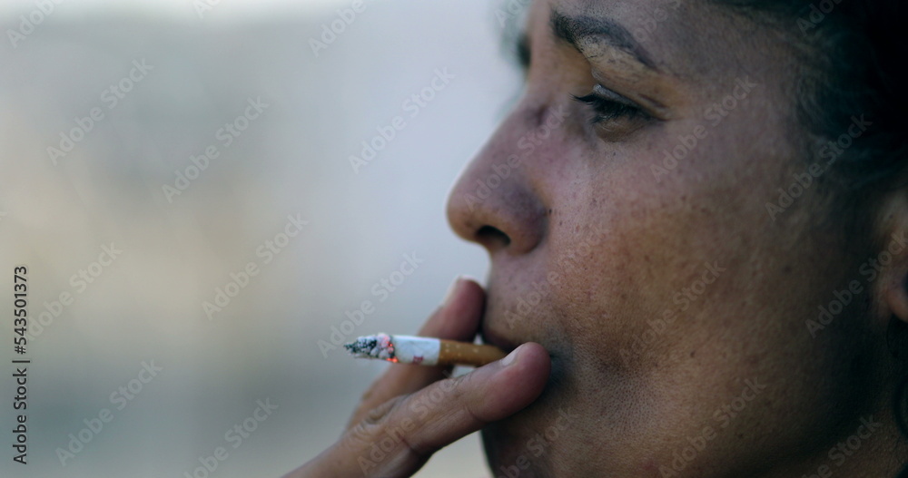 Sad depressed woman smoking cigarette. Real expression, tired person ...