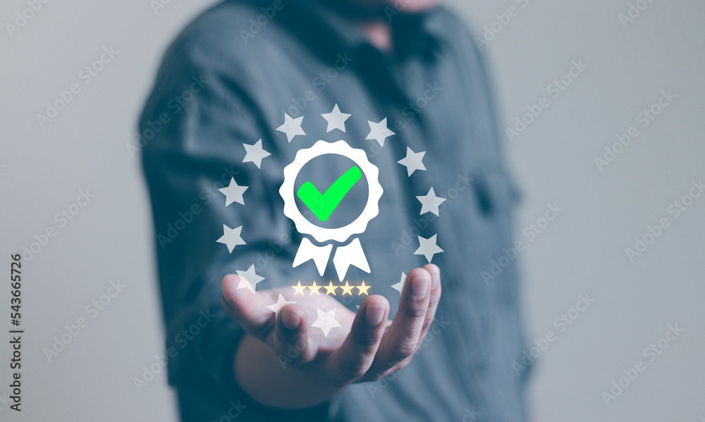 Hand shows the sign of the top service Quality assurance 5 star ...