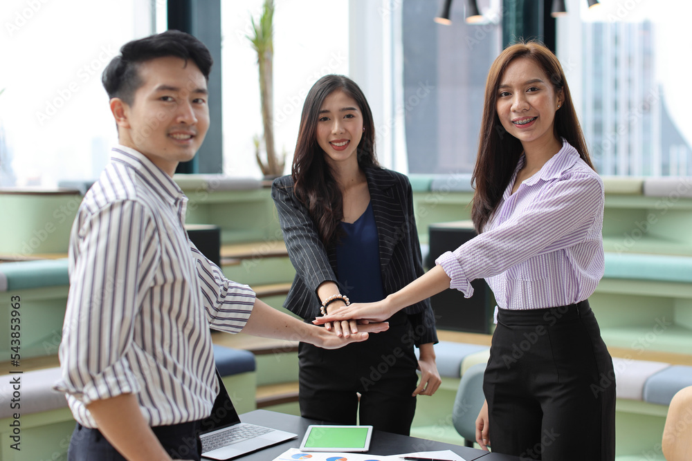 Collaborative process of professional asian businesspeople stacking ...