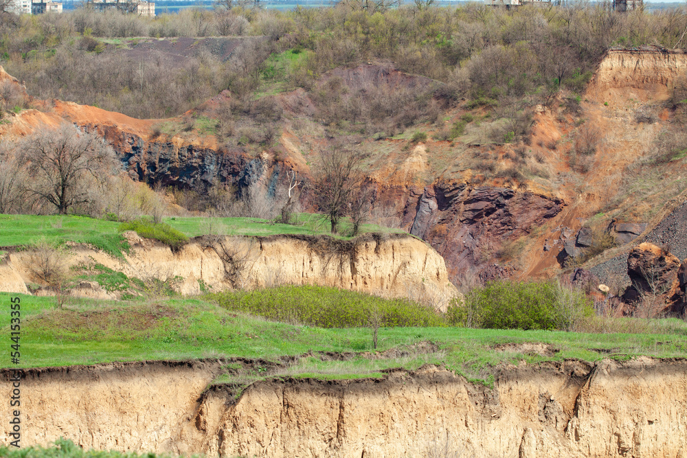 Soil erosion, sliding, and caving. Inside the landslide is rock ...
