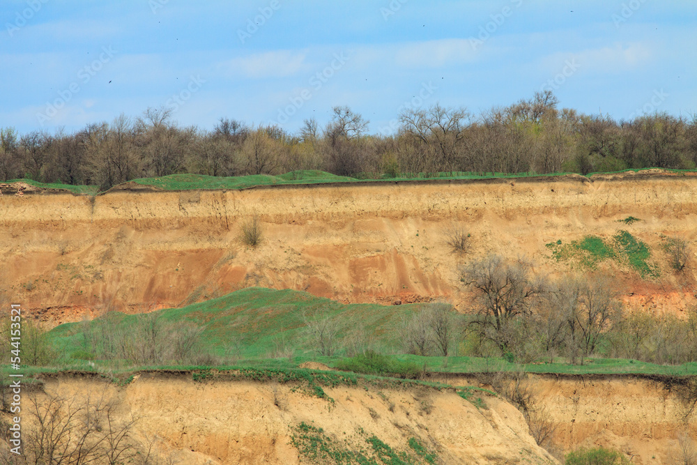 Soil erosion, sliding, and caving. Inside the landslide is rock ...