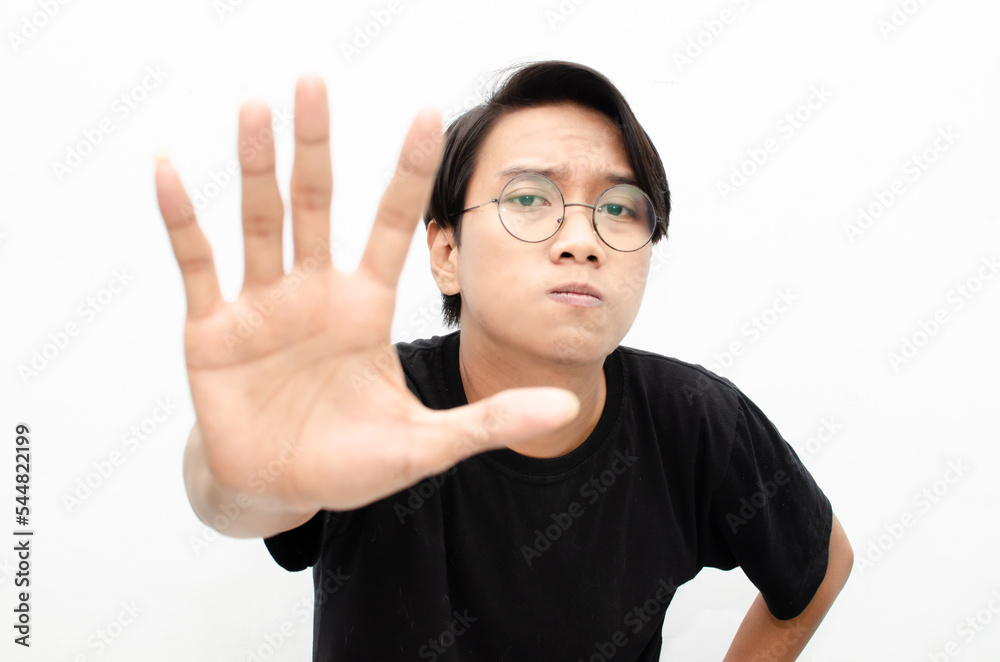 Ew. It's so gross. A young Asian man displaying an expression of ...