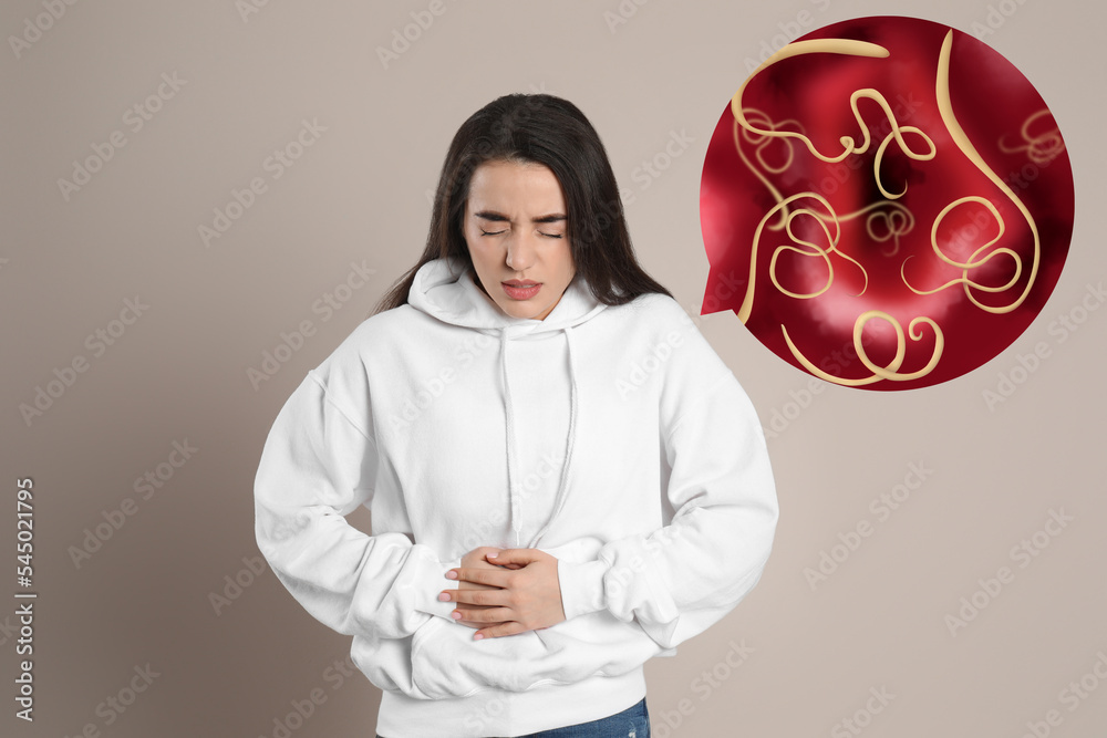 Parasites under microscope and woman suffering from helminthiasis Stock ...