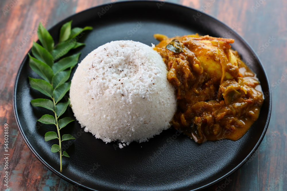 Rice Puttu or pittu steamed rice cake and egg roast curry popular in ...