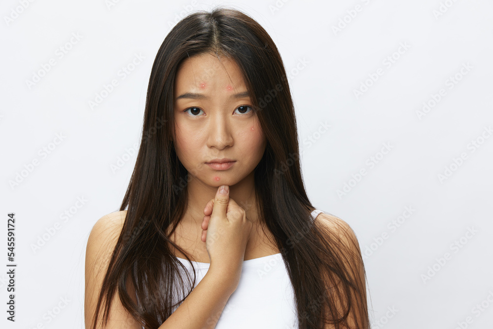 Foto de Stock Asian woman hand signals, finger pointing facial skin ...