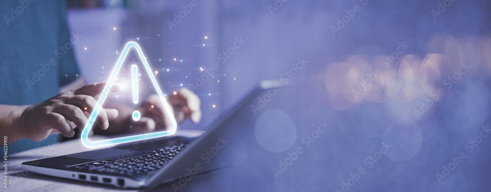 Businessman Using Computer Laptop With Triangle Caution Warning Sing For Notification Error And