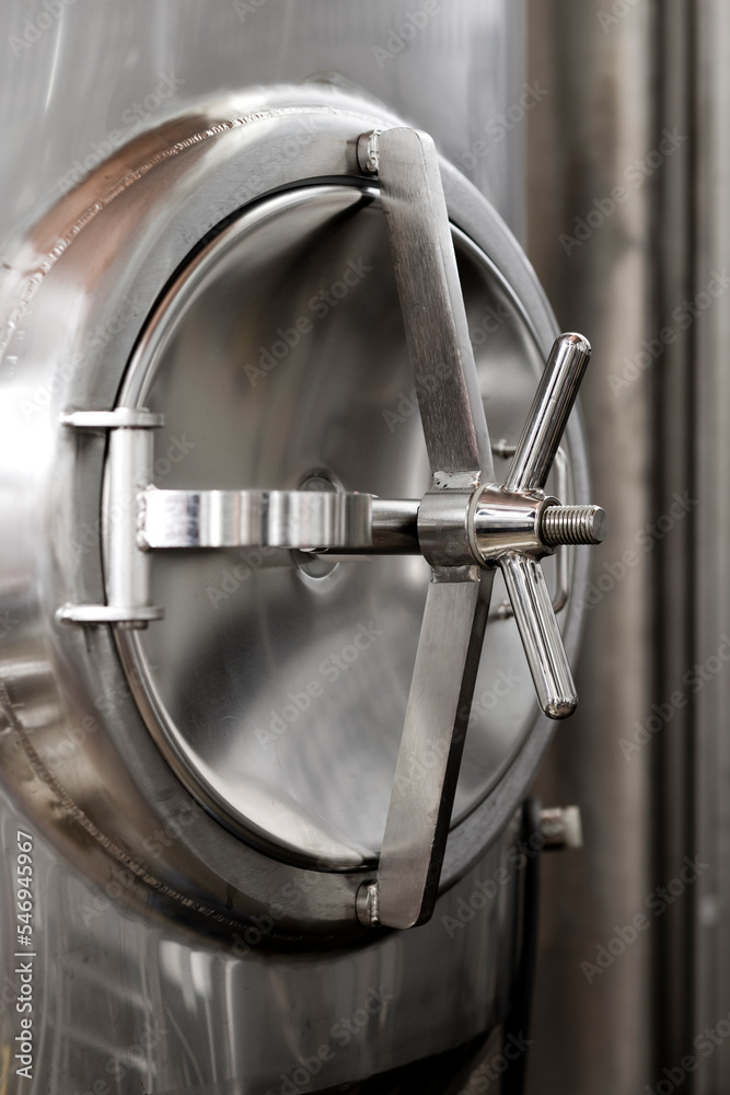 Access port on a tank for making beer in a commercial brewery. Stock ...