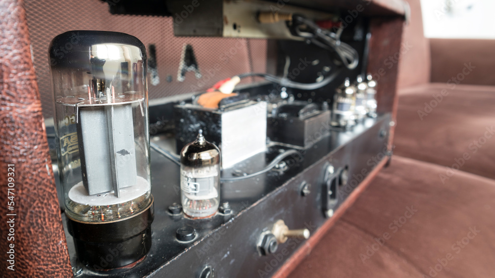 handcrafted brown leather covered amp head in the background 6l6 power ...