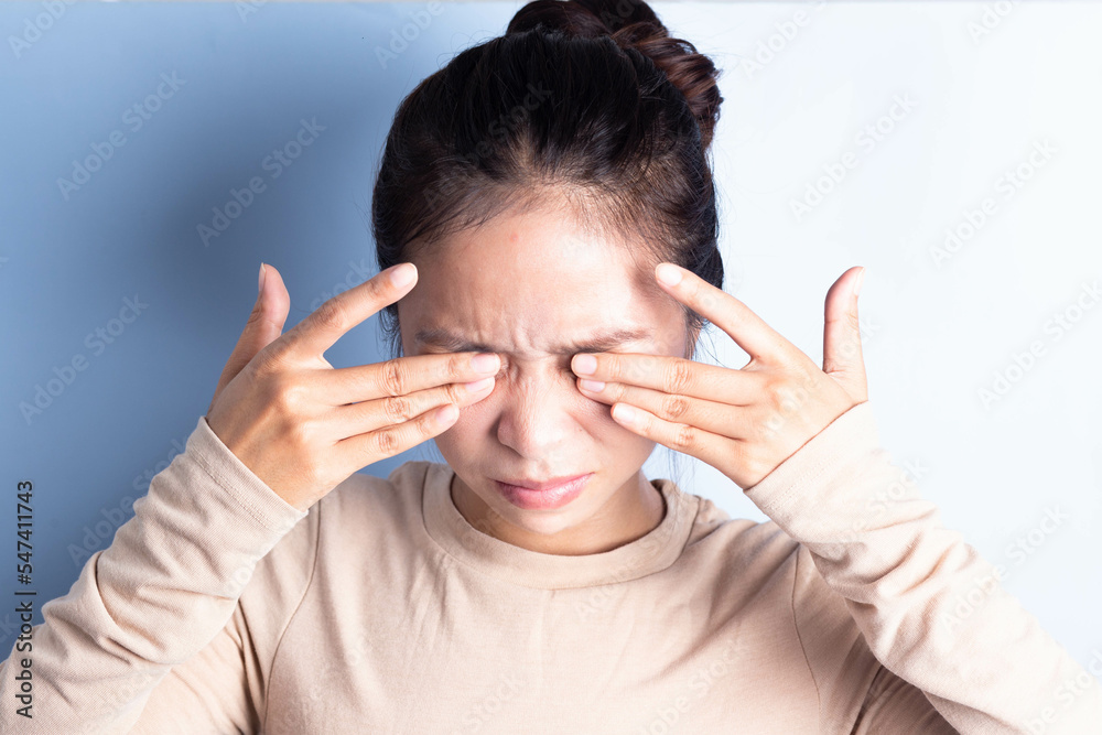 Close-up of young woman rubbing irritated eyes, eye irritation, eye ...