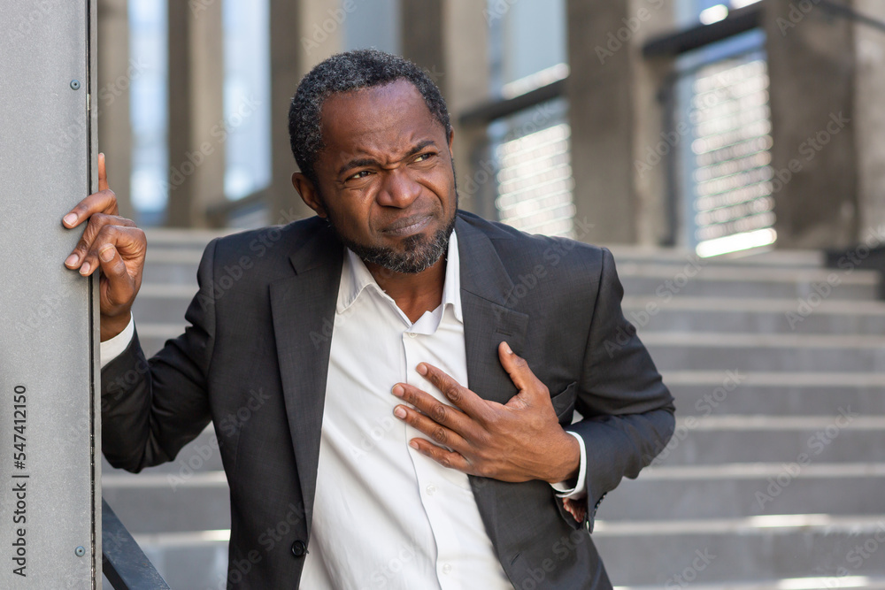 Heart attack , african american businessman has severe chest pain , man ...