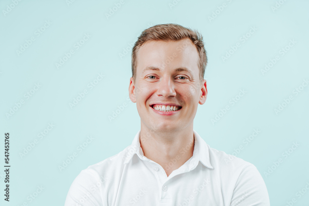 Young man smiling with natural white teeth in dental clinic on light ...
