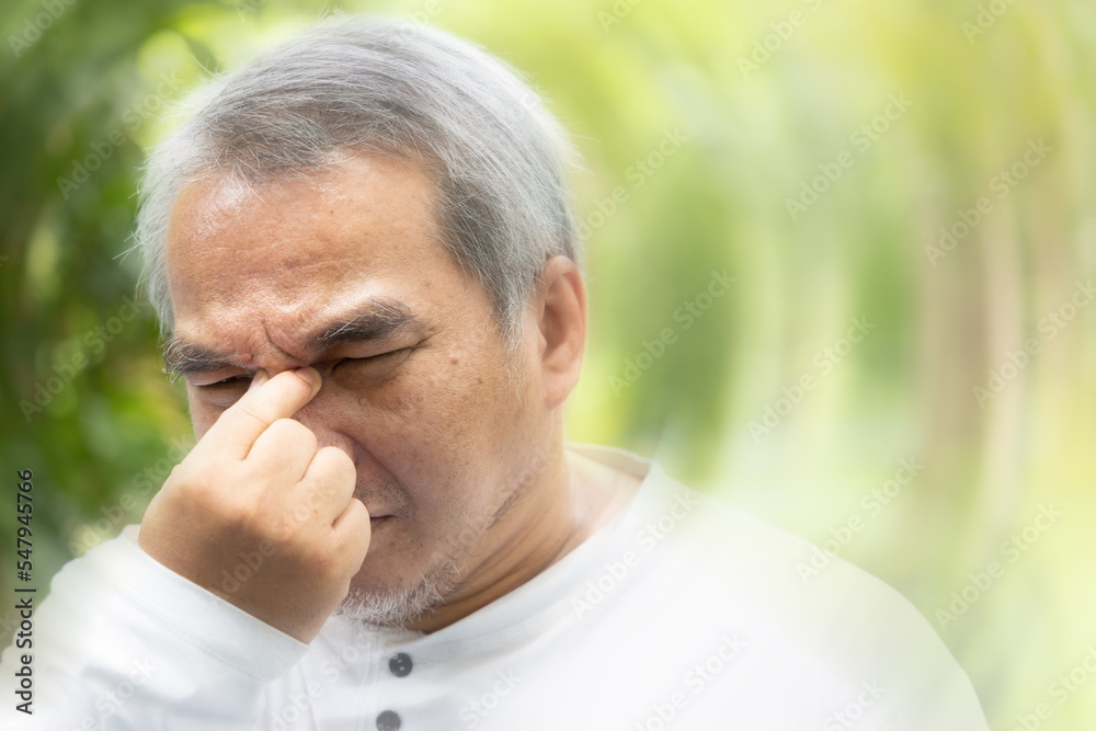 Old asian senior man suffering from headache, health and sickness ...