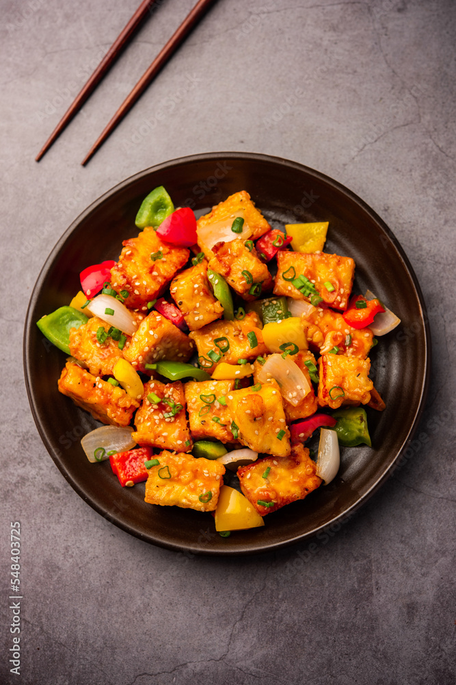 chilli paneer dry is made using cottage cheese, Indo chinese food Stock ...