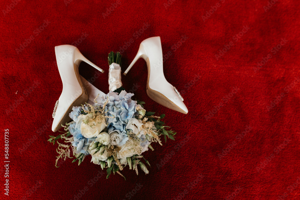 White Heels Filled With Flower Bouquet On a red carpet, white heels ...