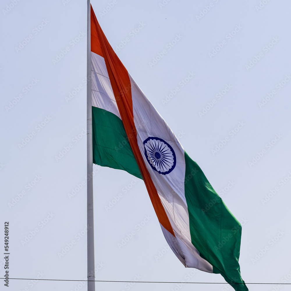 India flag flying high at Connaught Place with pride in blue sky, India ...
