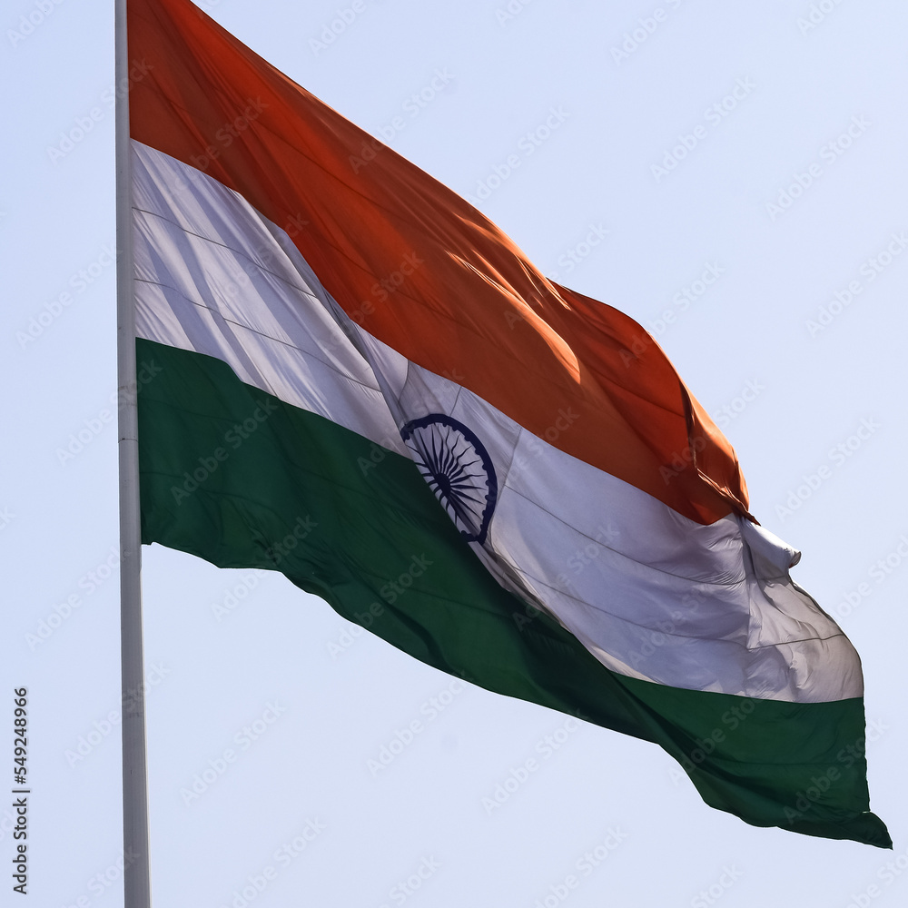 India flag flying high at Connaught Place with pride in blue sky, India ...
