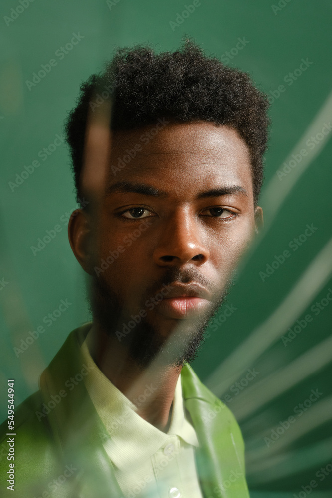 Vertical close-up broken mirror effect studio shot of modern young ...