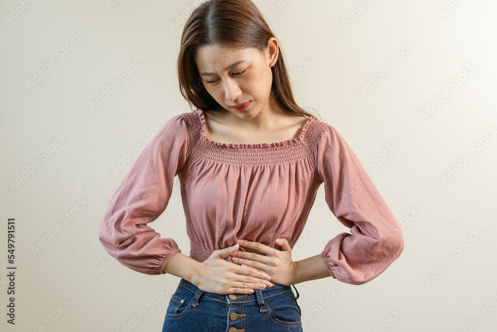 Flatulence young asian woman, girl hand in stomach ache, suffer from ...
