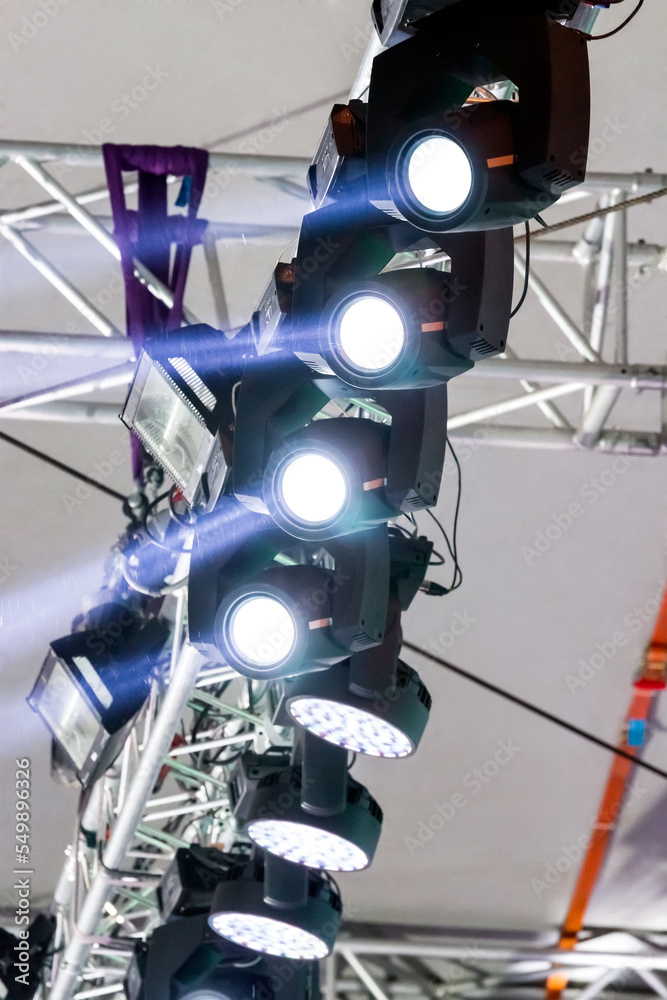 multiple spotlights on outdoor concert stage lighting rig. stage lights ...