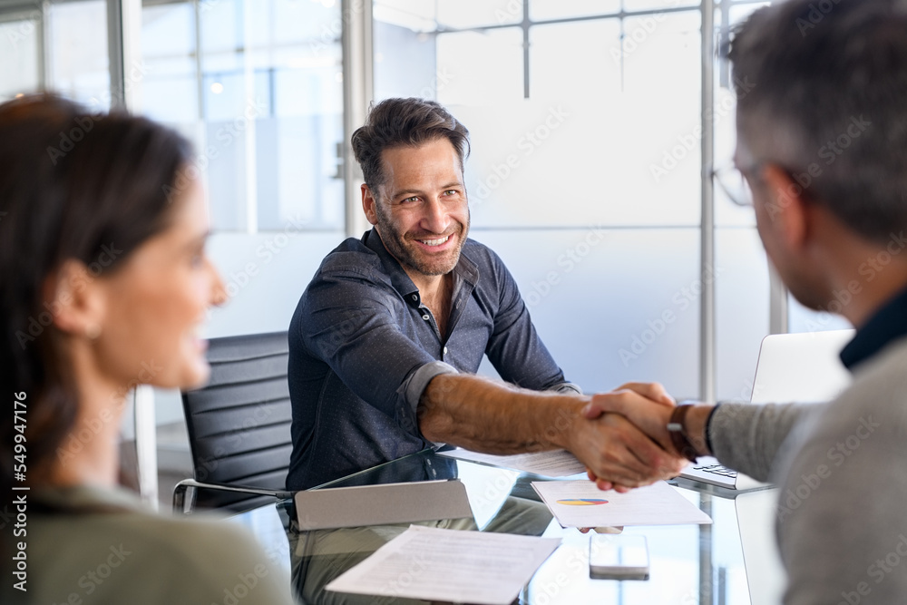 Businessman shaking hands with client Stock Photo | Adobe Stock